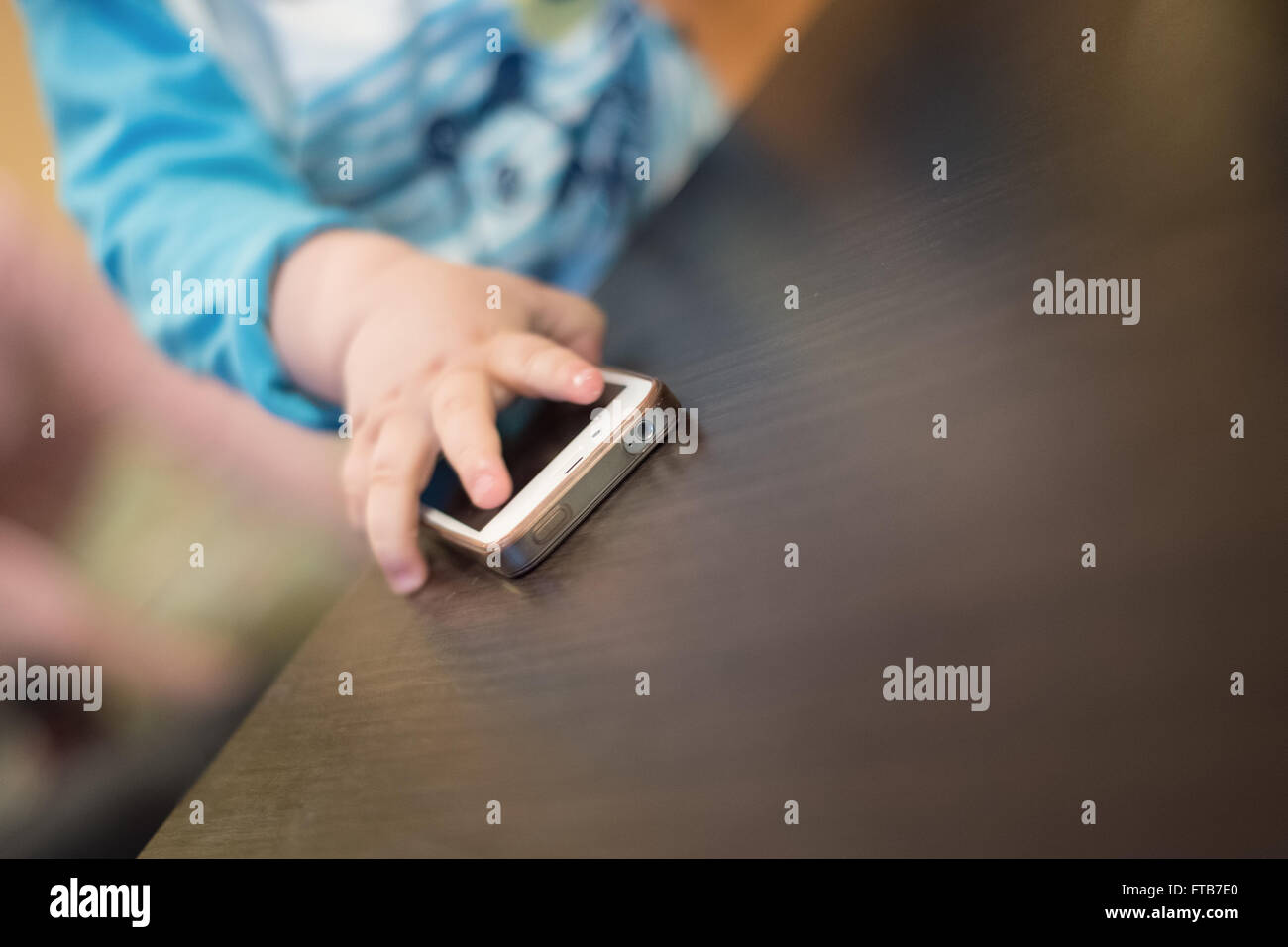 Child grabbing toy hi-res stock photography and images - Alamy