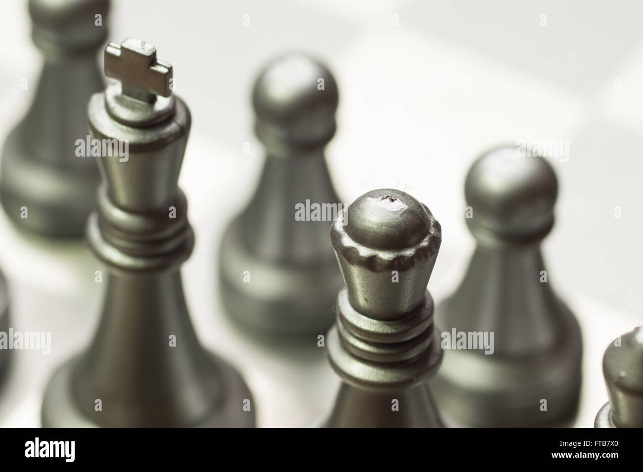 Light and dark wooden chess pieces on chess table. High resolution ...