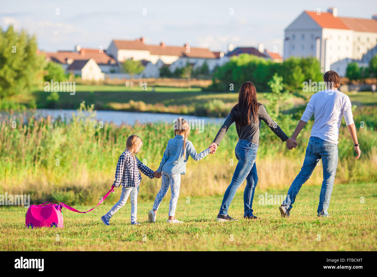 Happy family with baggage ready for traveling outdoors Stock Photo - Alamy
