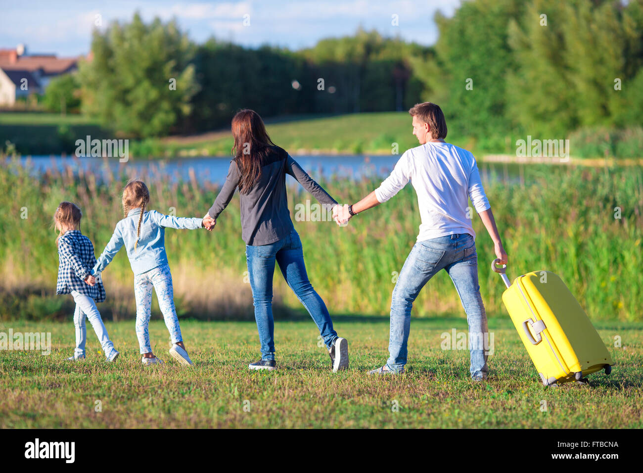 Happy family luggage ready traveling hi-res stock photography and ...