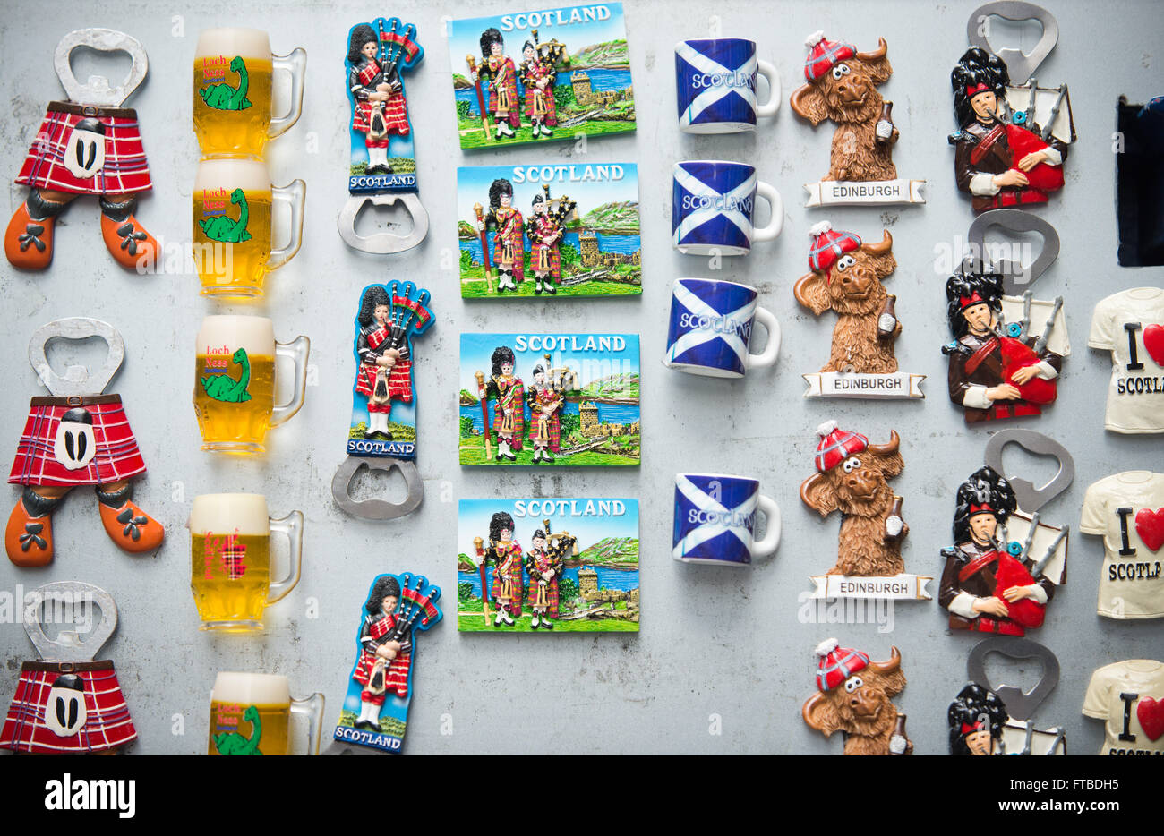 Kitsch Scottish Fridge Magnets are seen pinned to a dirty board on the ...