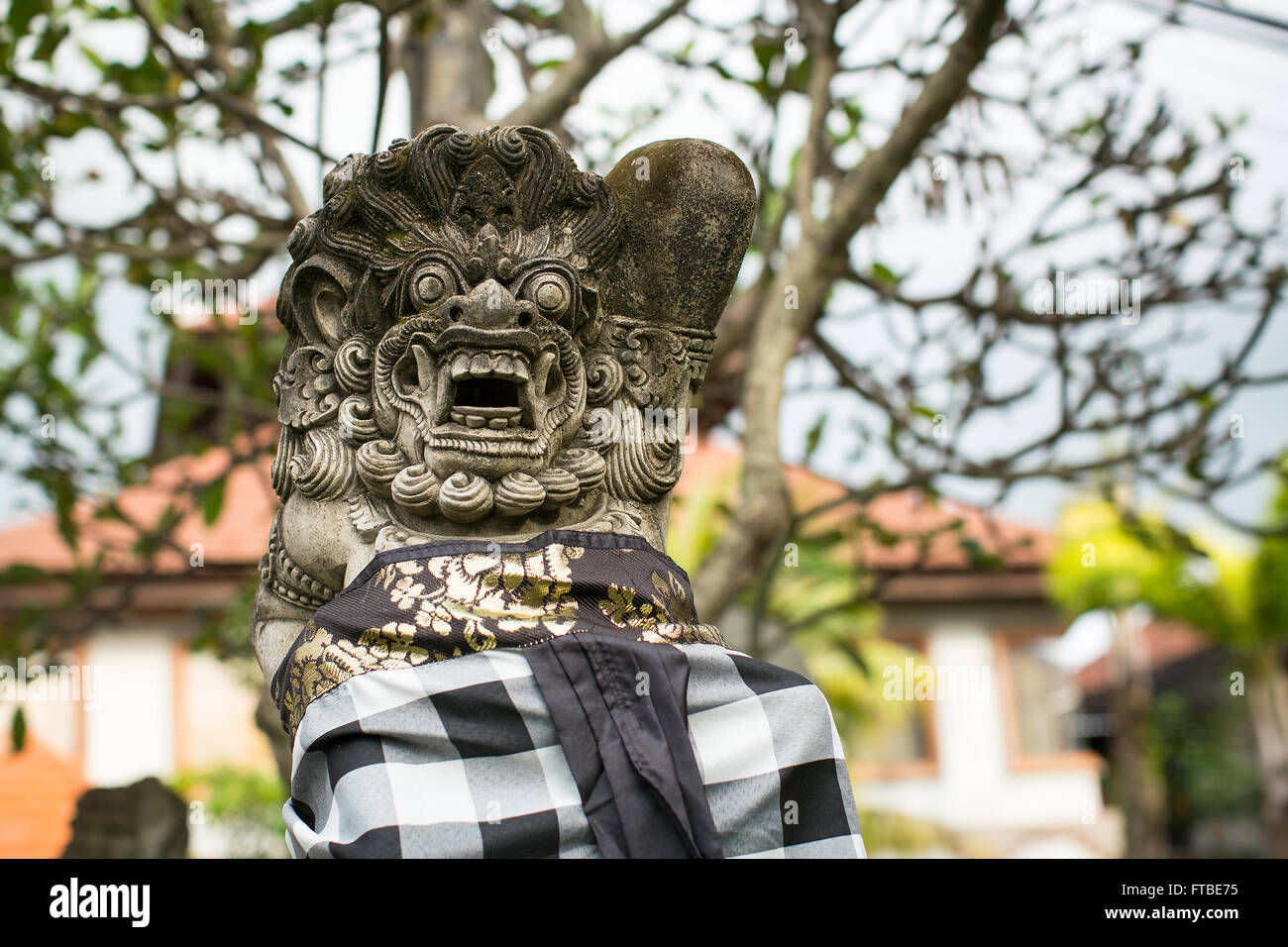Traditional demon statue carved in stone on Bali, Indonesia Stock Photo ...
