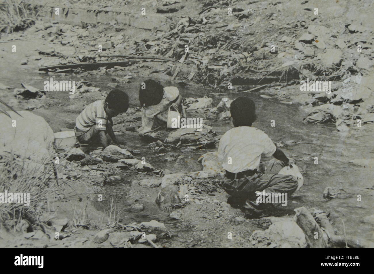 children rummaging through garbage Stock Photo - Alamy