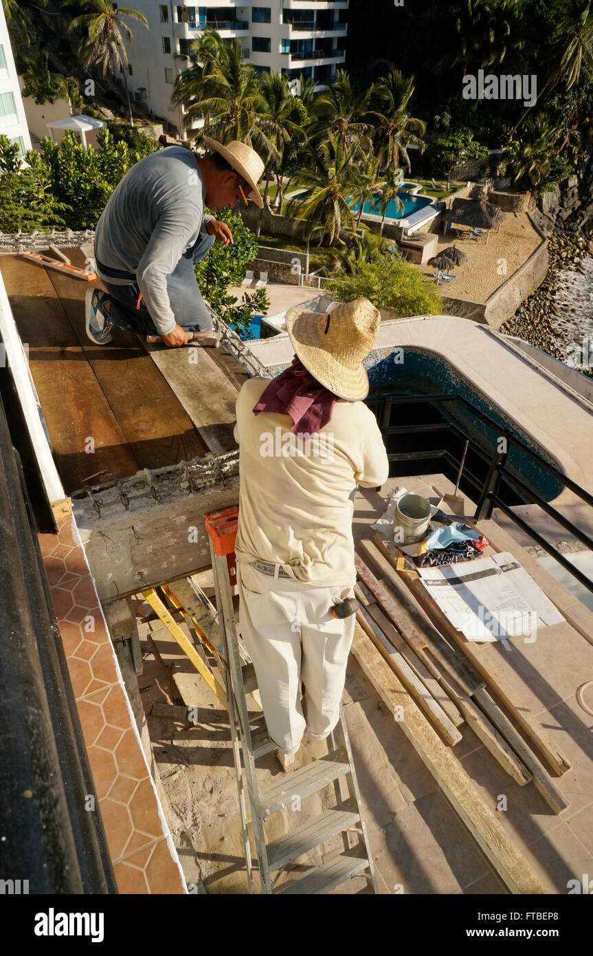 Mexican men building small terrace on home in Acapulco, Mexico Stock ...