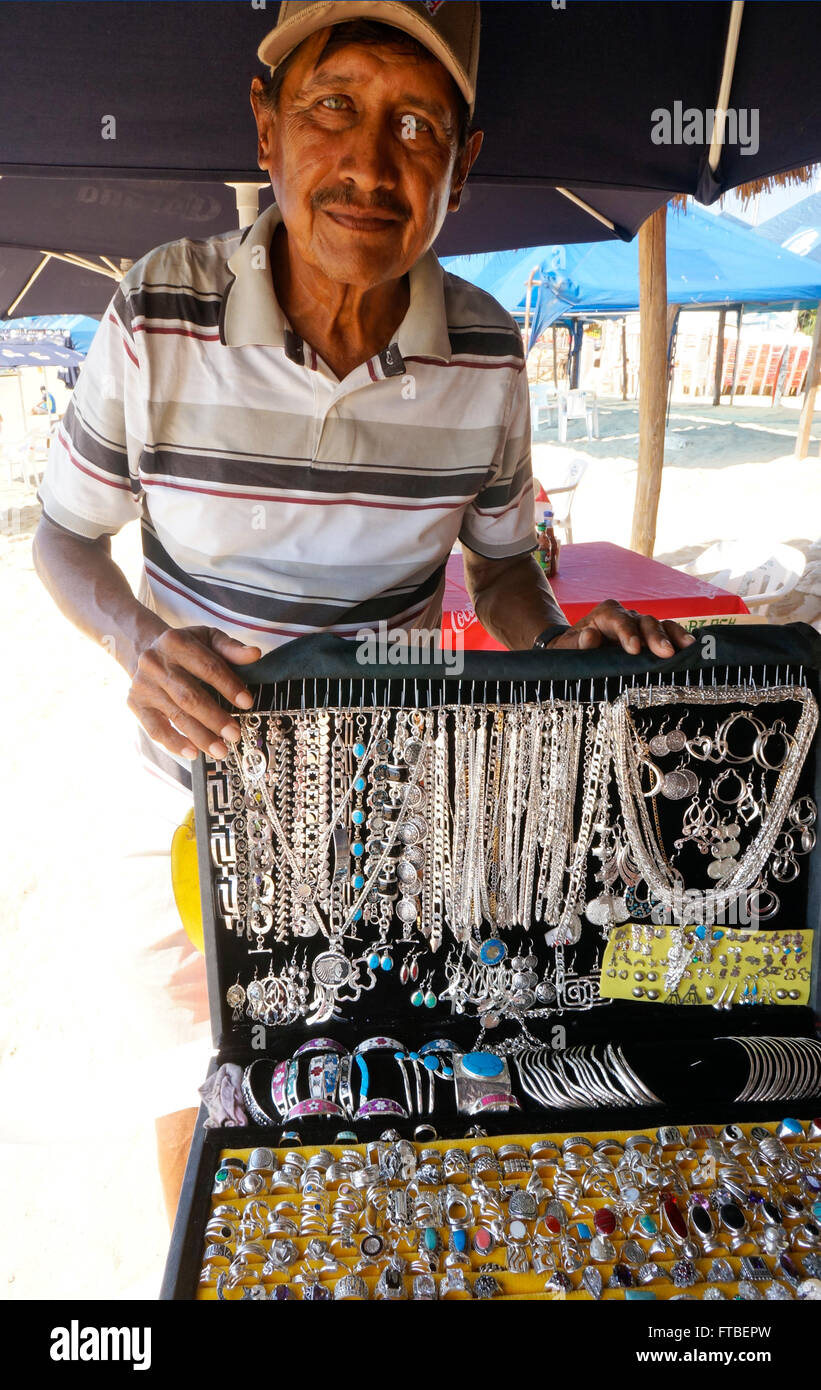 Beach vendor selling silver jewelry on beach in Acapulco, Mexico Stock ...