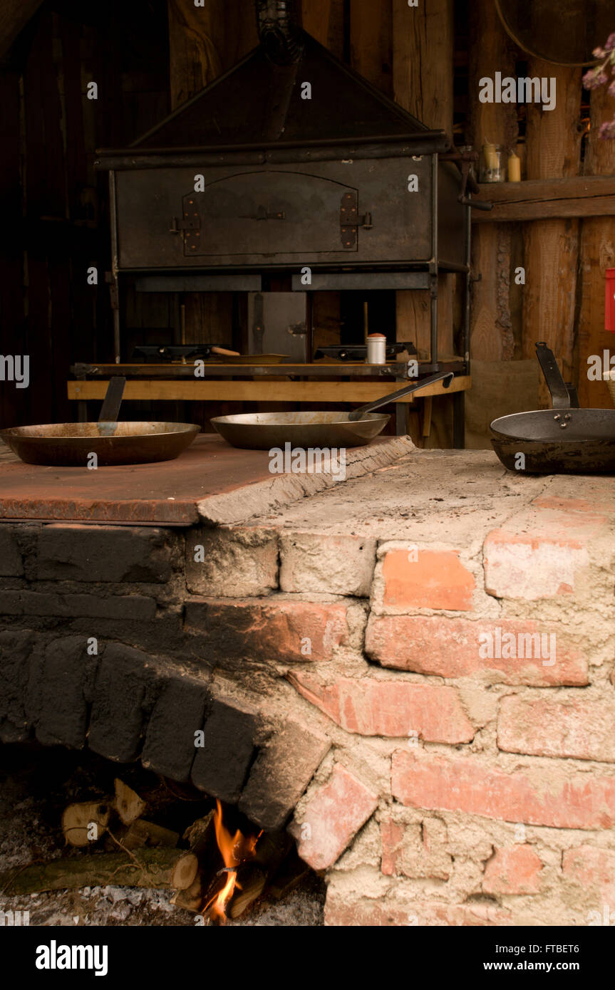 Rural outdoor kitchen with pots and pans Stock Photo - Alamy