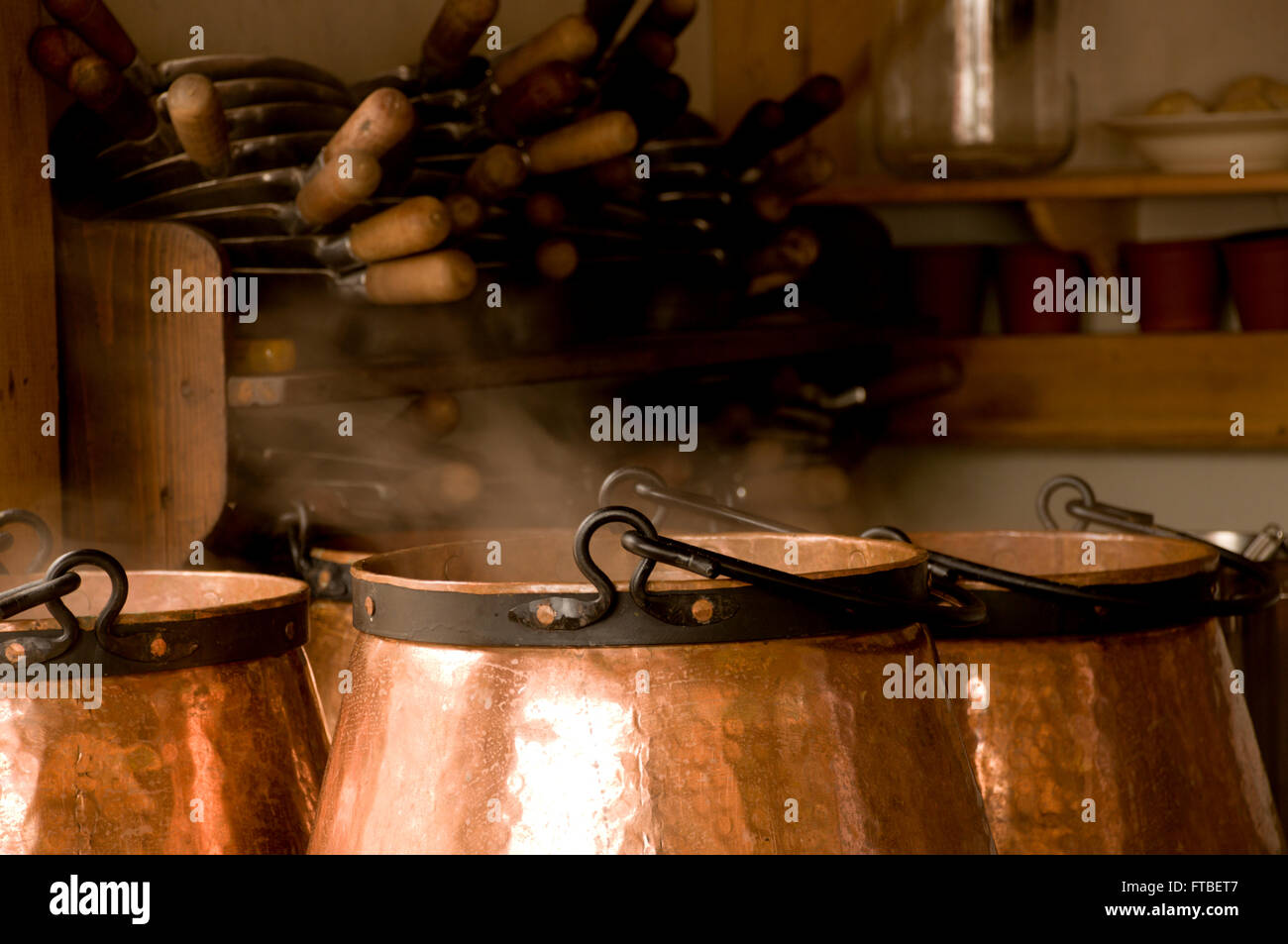 Copper cookers with steaming food inside Stock Photo - Alamy