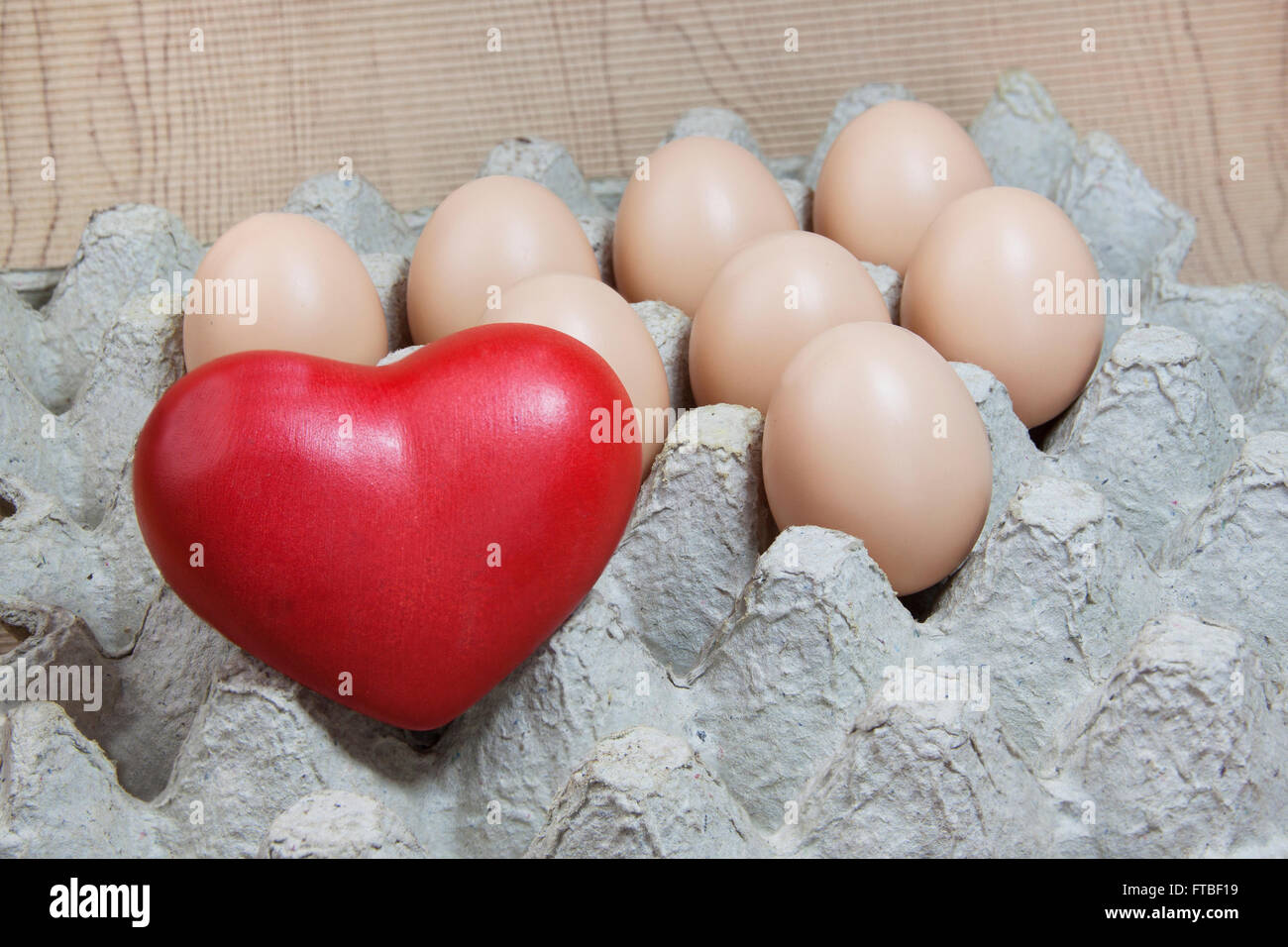 Heart and eggs on paper panel and paper pattern wood Stock Photo - Alamy