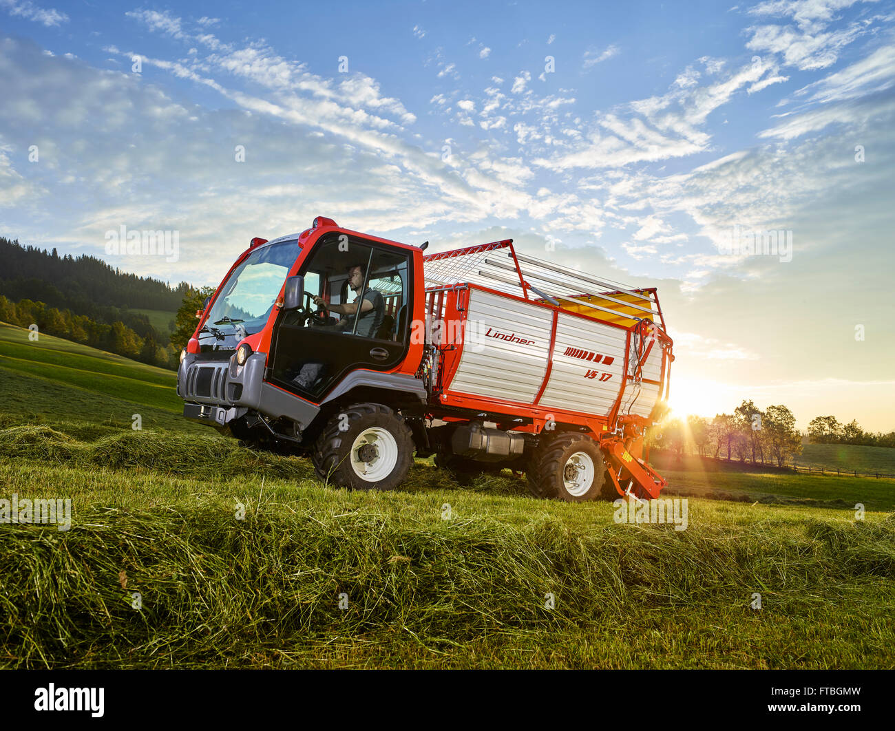 Unitrac transporter with forage trailer collecting the dried grass ...