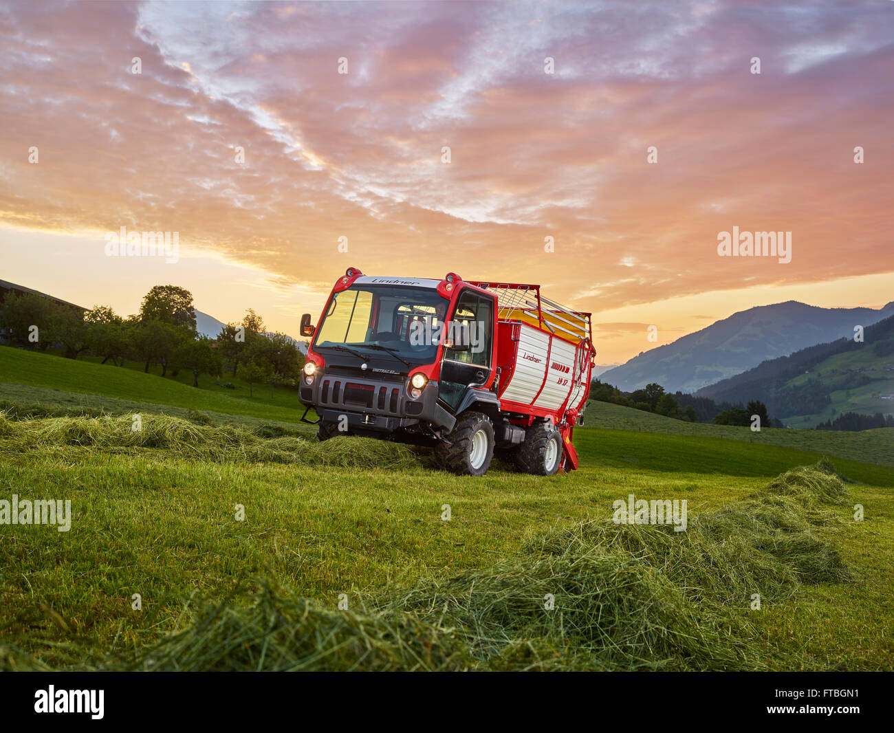 Unitrac transporter with forage trailer collecting the dried grass ...