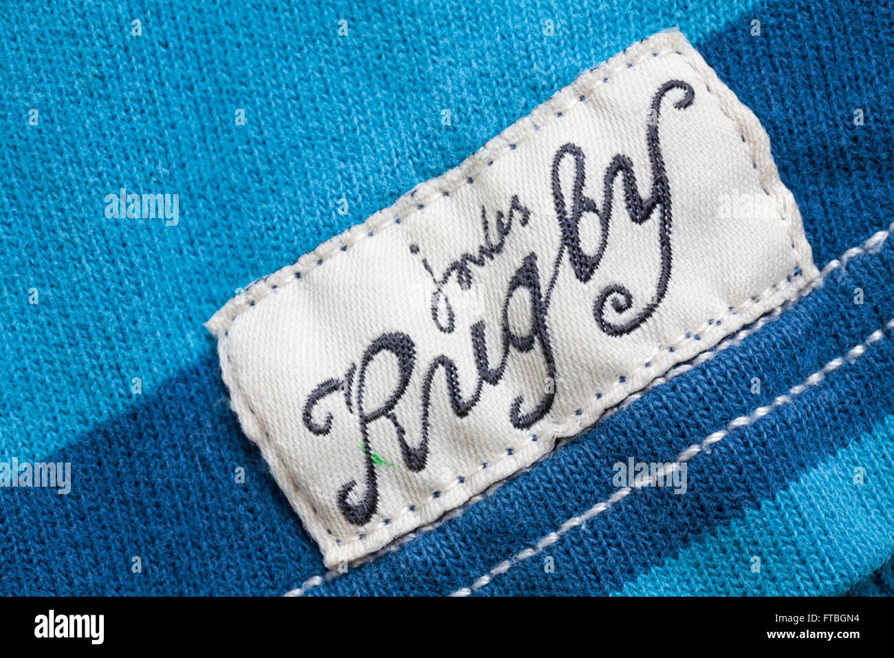 Joules Rugby label on side of boy's Joules rugby shirt Stock Photo - Alamy