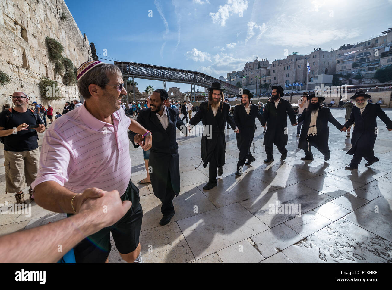 Orthodox Jews dancing in front of Western Wall (also called Kotel or ...