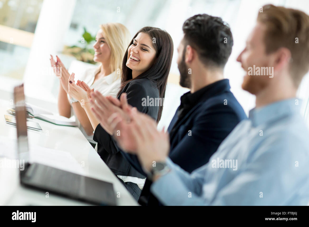 View of the business people clapping in the office Stock Photo - Alamy