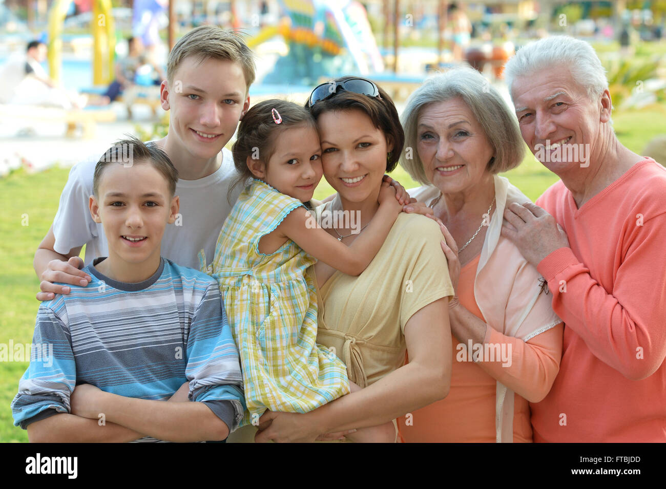 Family relaxing at resort Stock Photo - Alamy