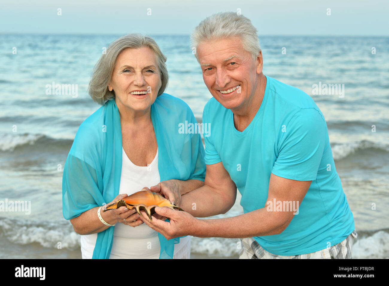 elderly couple rest at tropical resort Stock Photo - Alamy