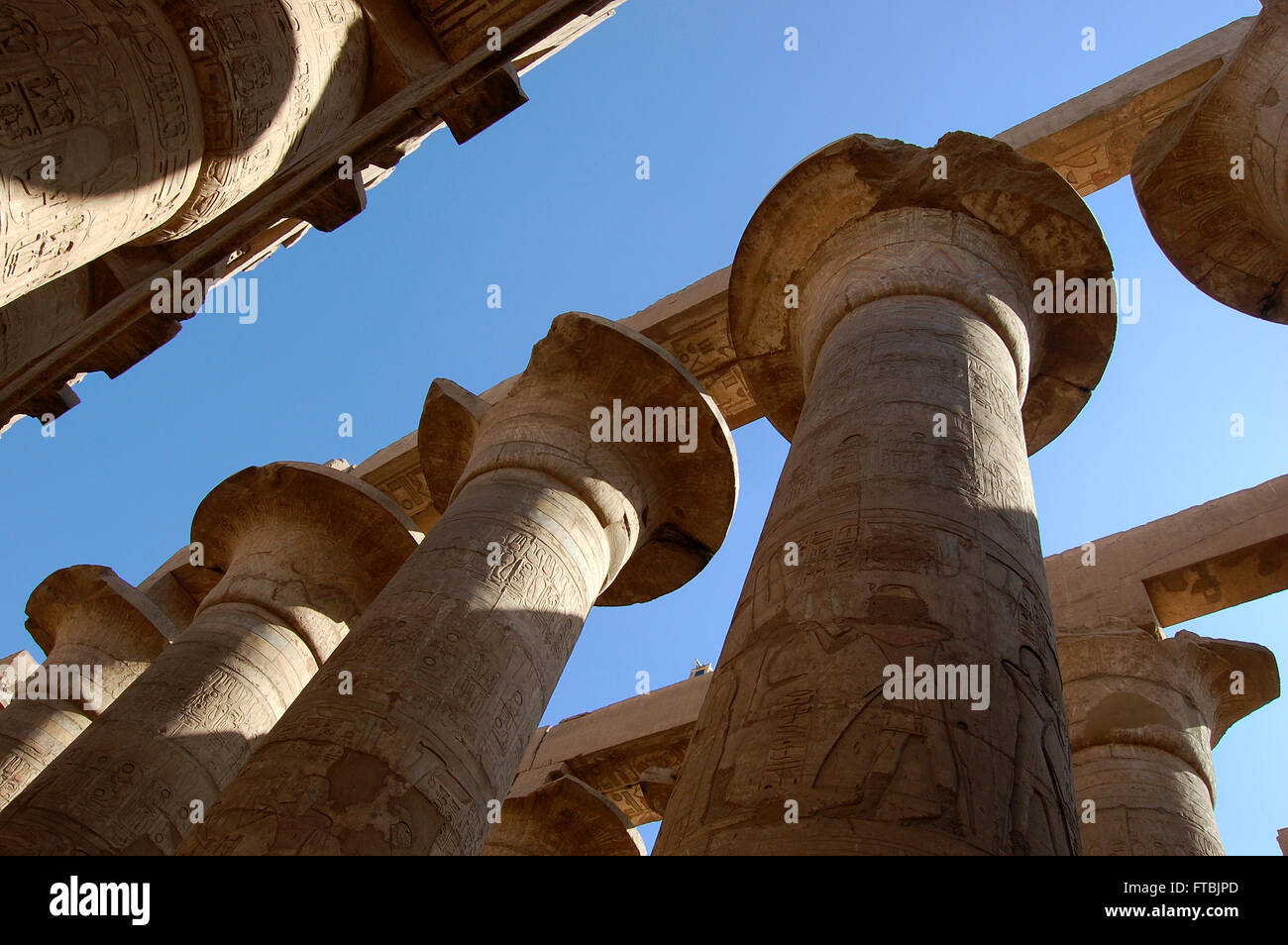 Carved hieroglyphs on columns at Egyptian temple Stock Photo - Alamy