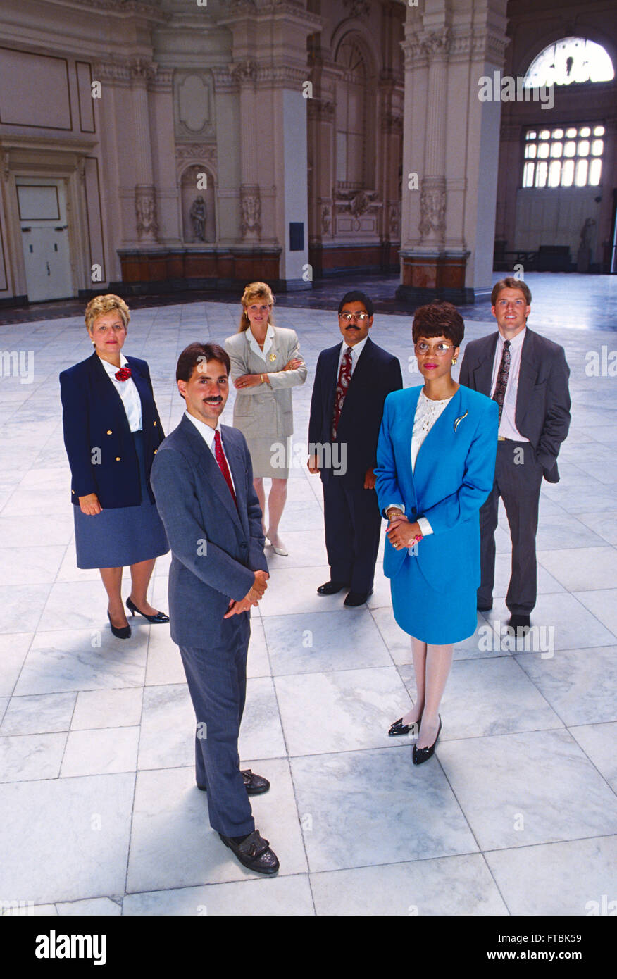 Group portrait if male & female bank employees Stock Photo - Alamy