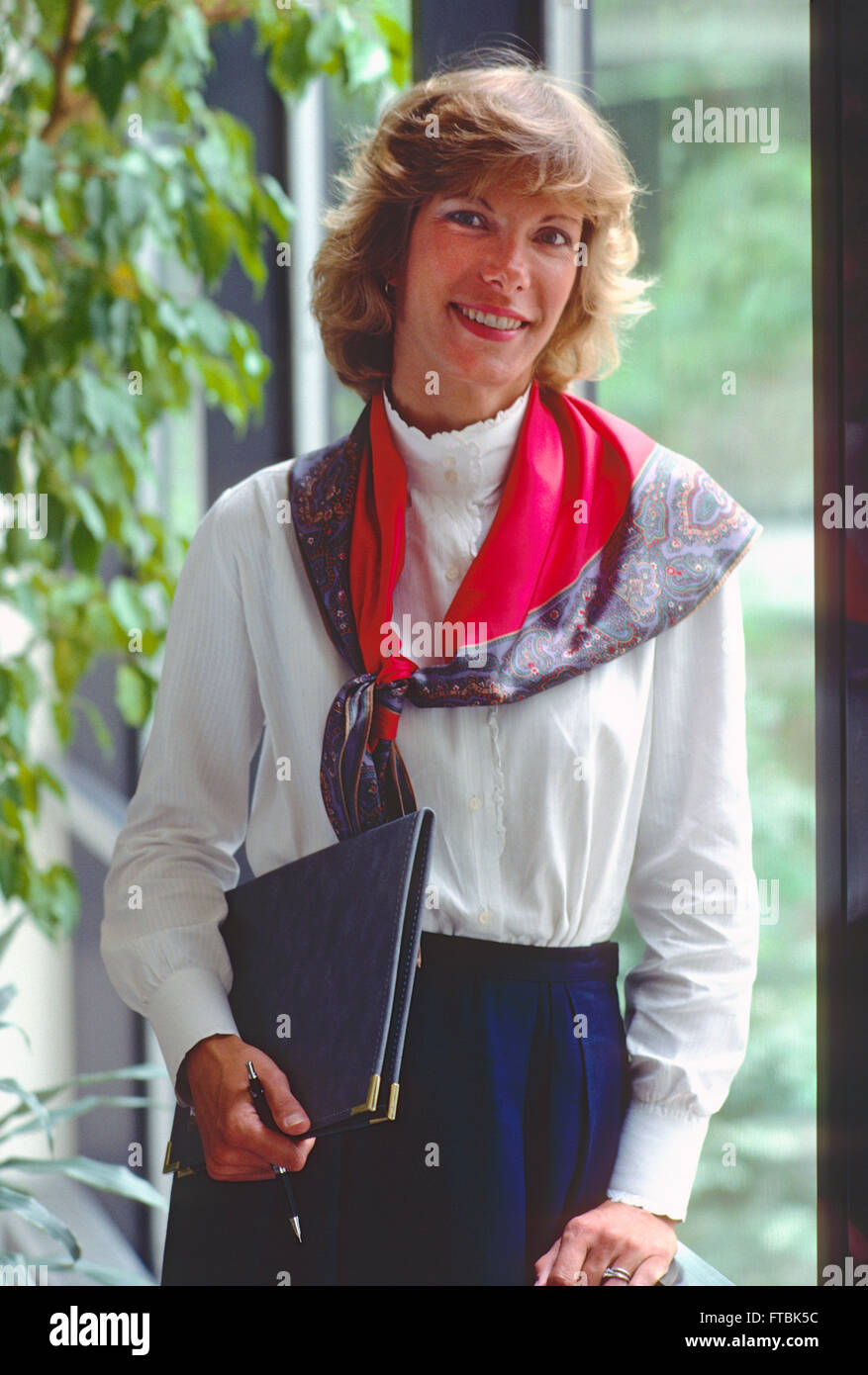 Portrait of female corporate executive Stock Photo - Alamy