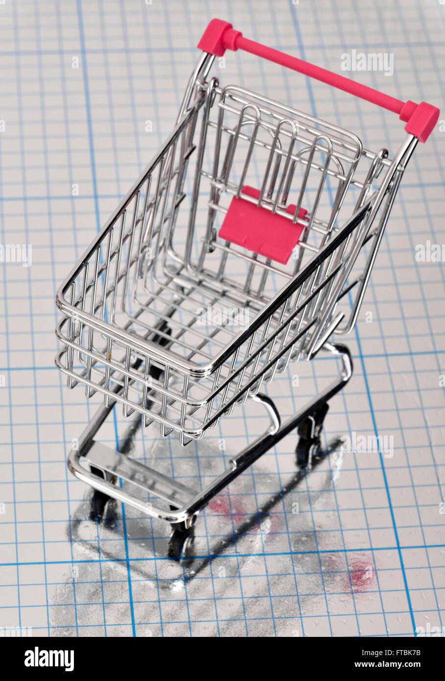 Small supermarket shopping trolley Stock Photo - Alamy