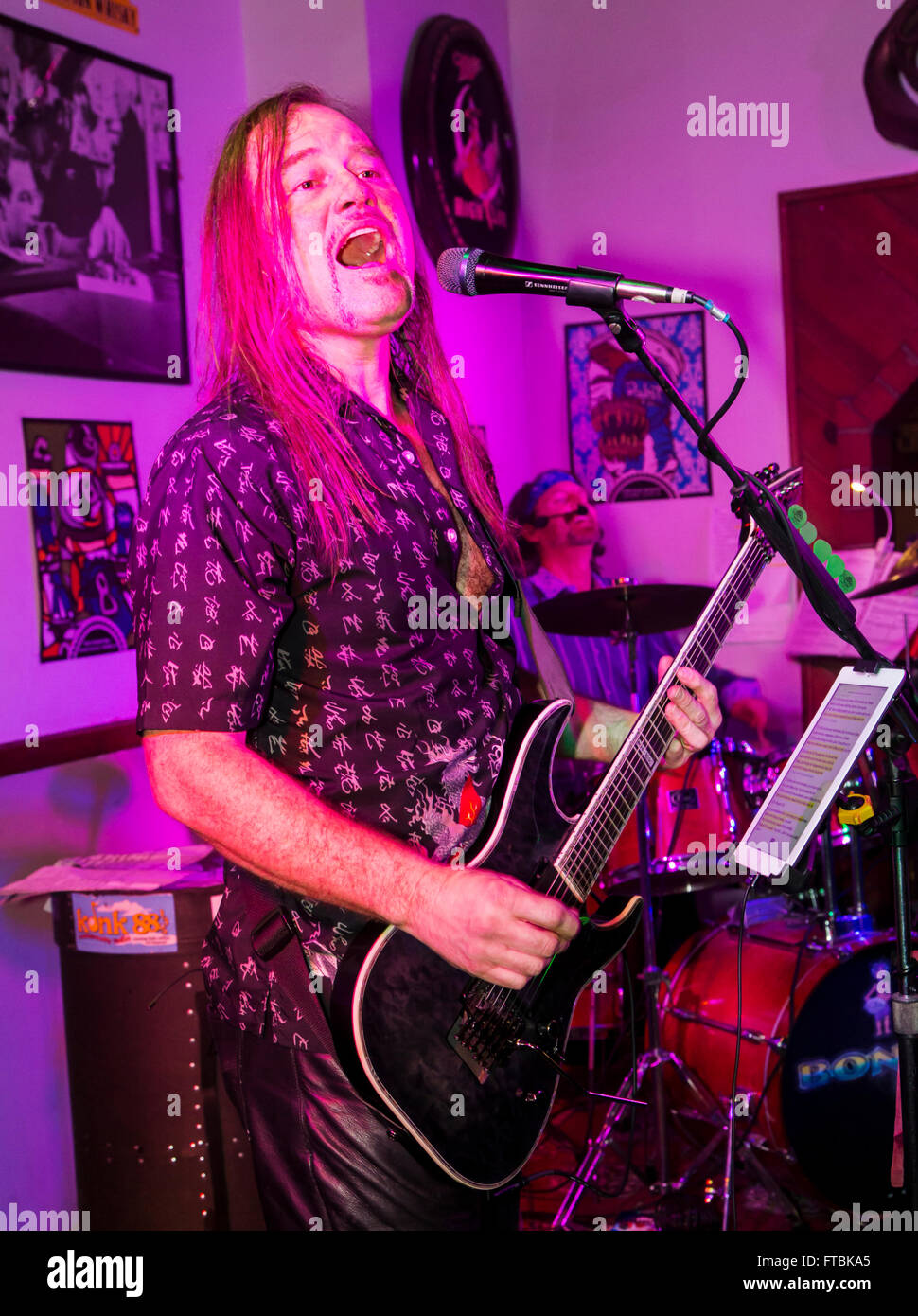 Vocalist & guitarist Robb Warnke; Rock & Roll band Hairitage playing ...