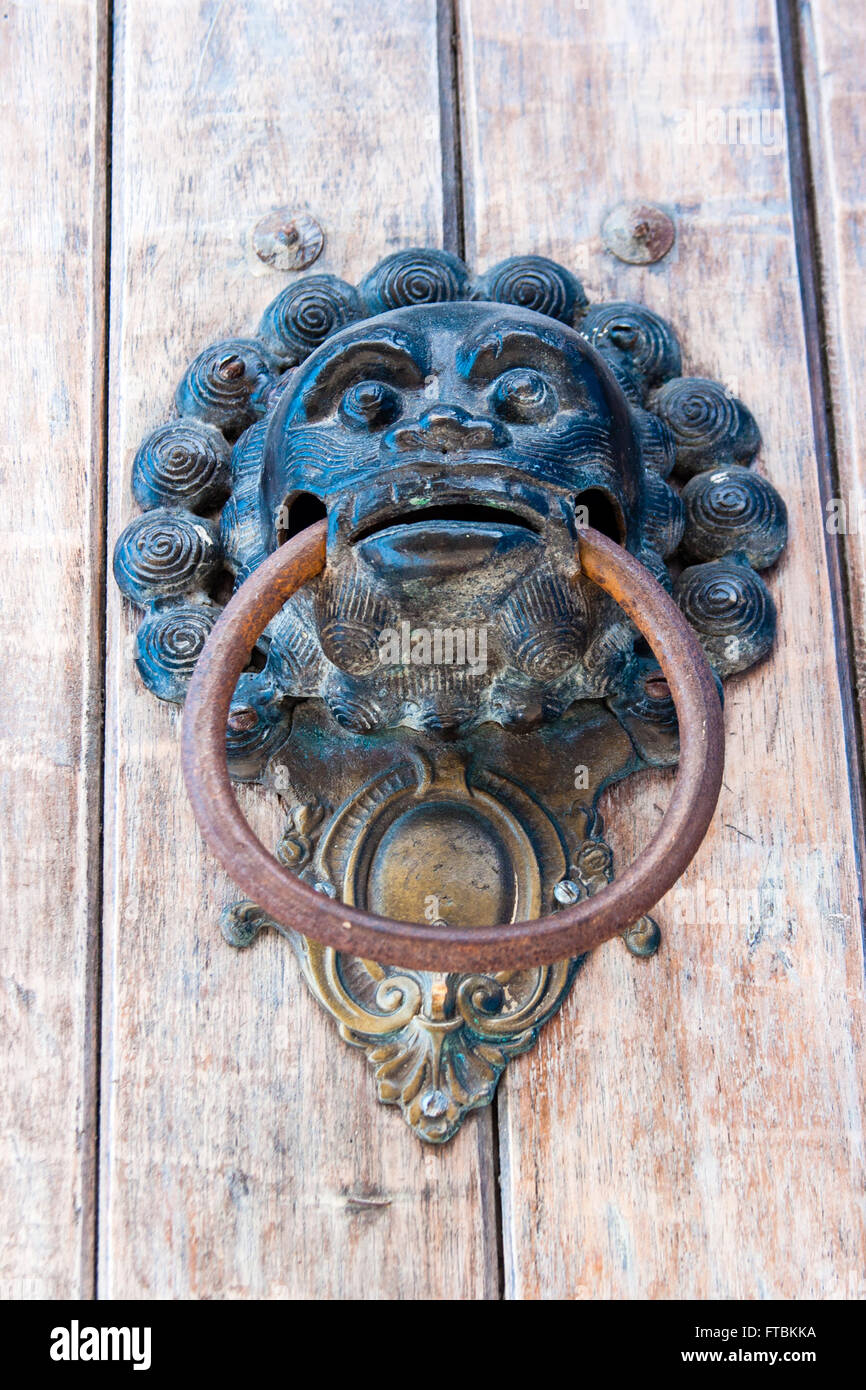 Door knocker monkey shaped Stock Photo - Alamy
