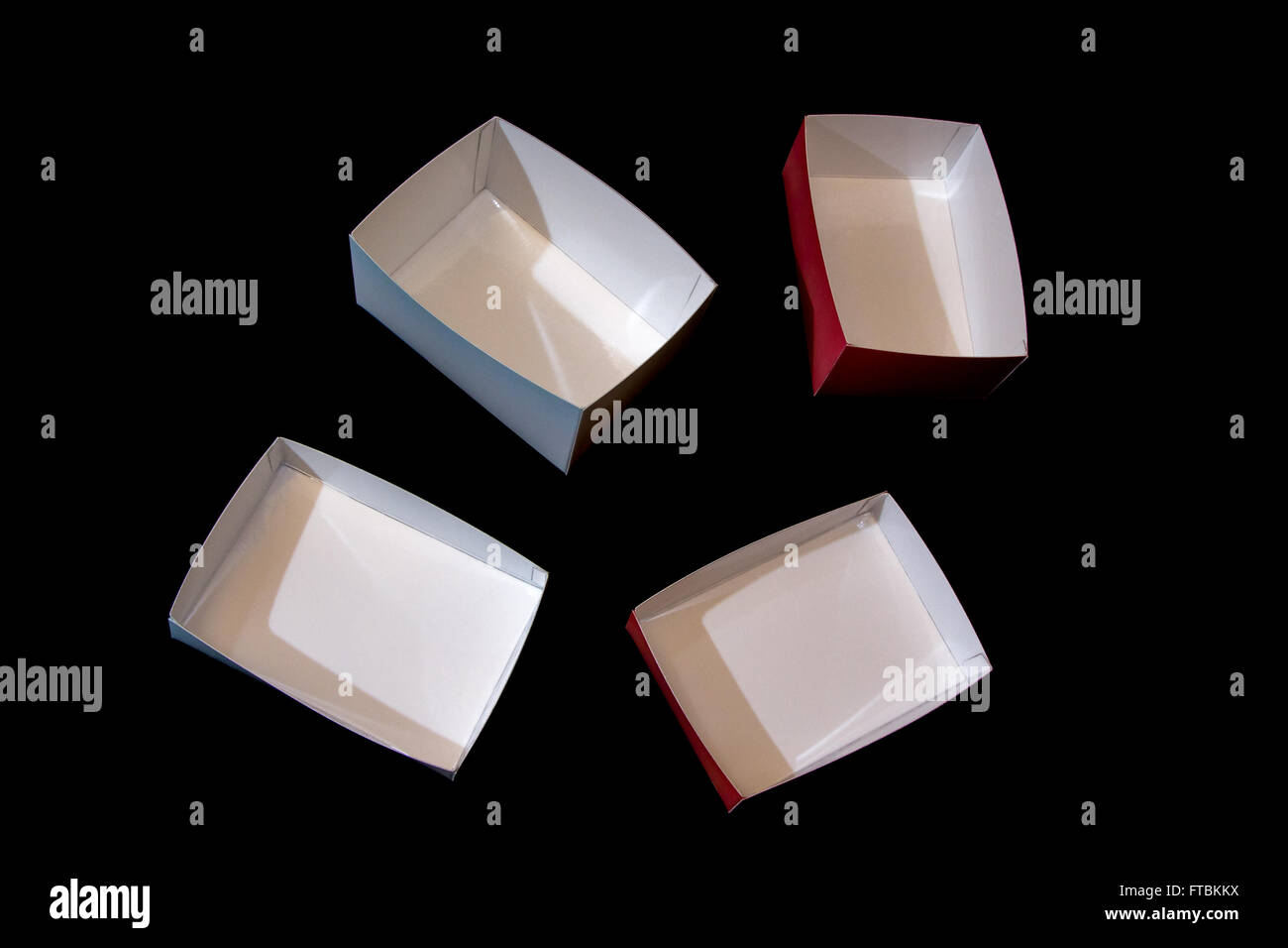 four small colored boxes made of laminated paper Stock Photo - Alamy