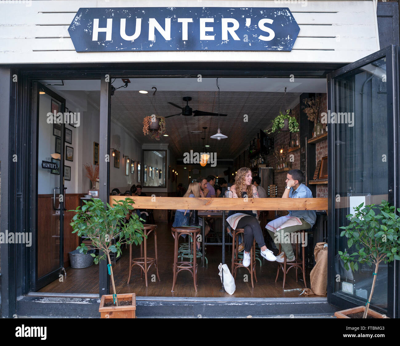 Two people chat in a restaurant in Brooklyn, New York City Stock Photo ...