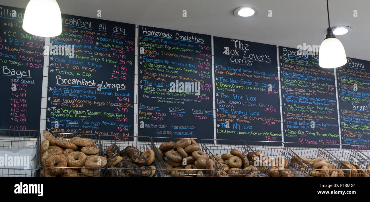 A chalkboard lists all the items available at a deli in Brooklyn Stock ...