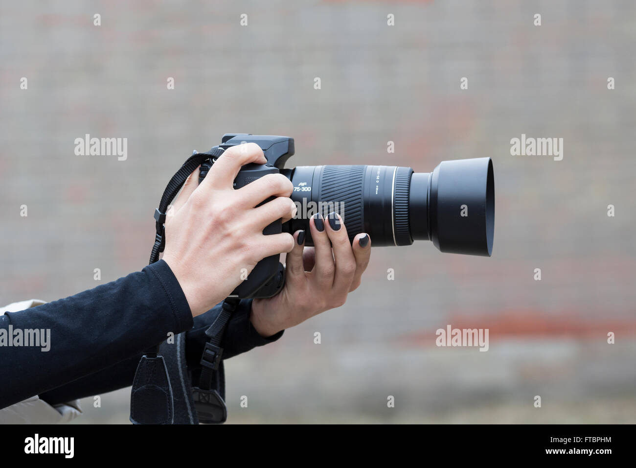 camera in the hands of girls Stock Photo - Alamy