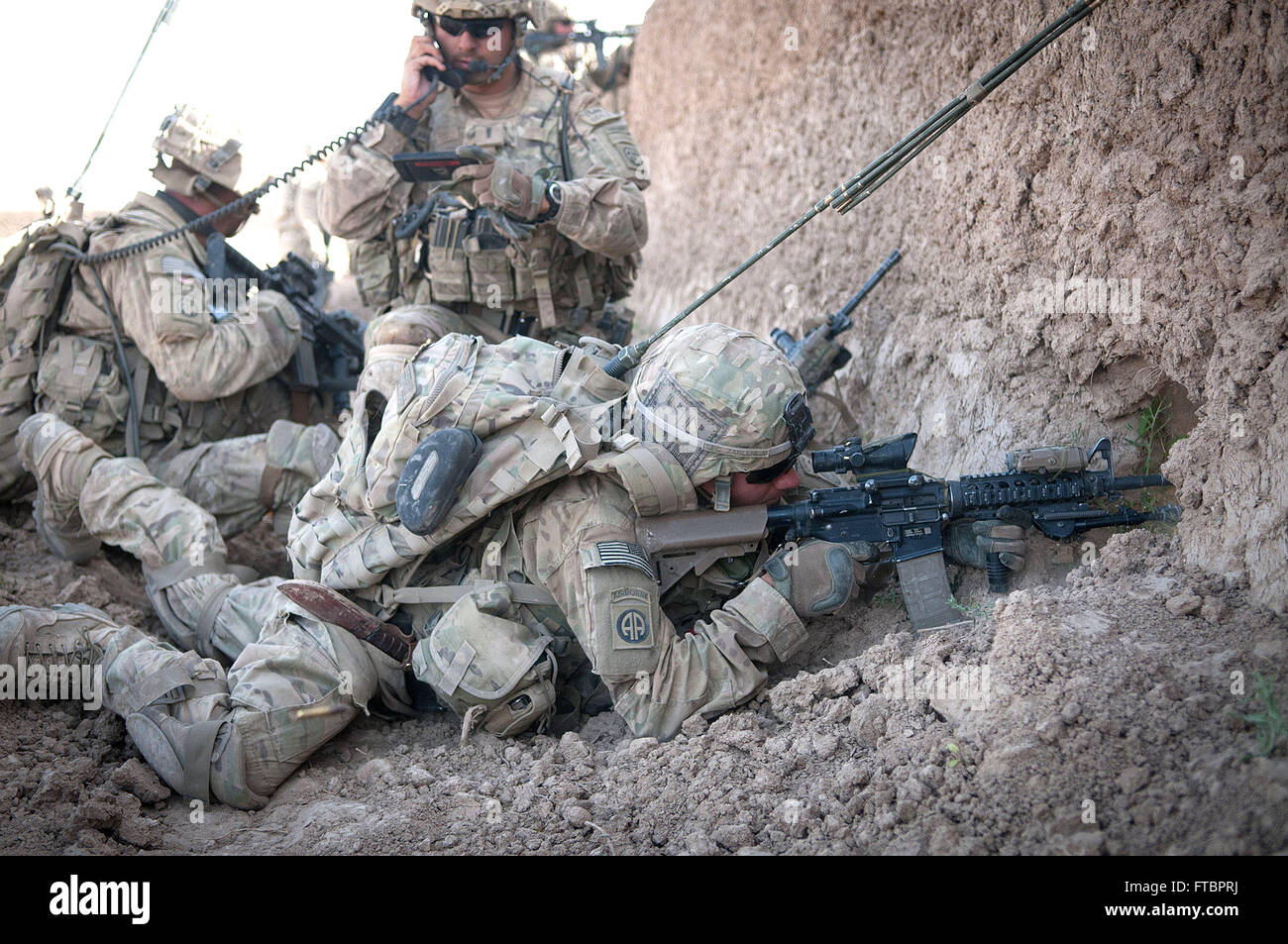 U.S. Army paratroopers with the 82nd Airborne Division return fire ...
