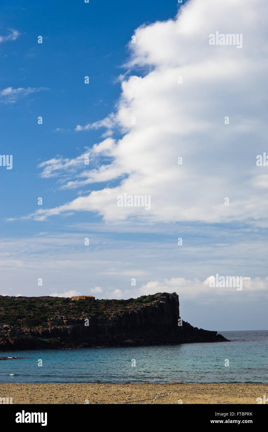 Cliffs at the end of sandy beach in San Pietro island, Sardinia Stock ...