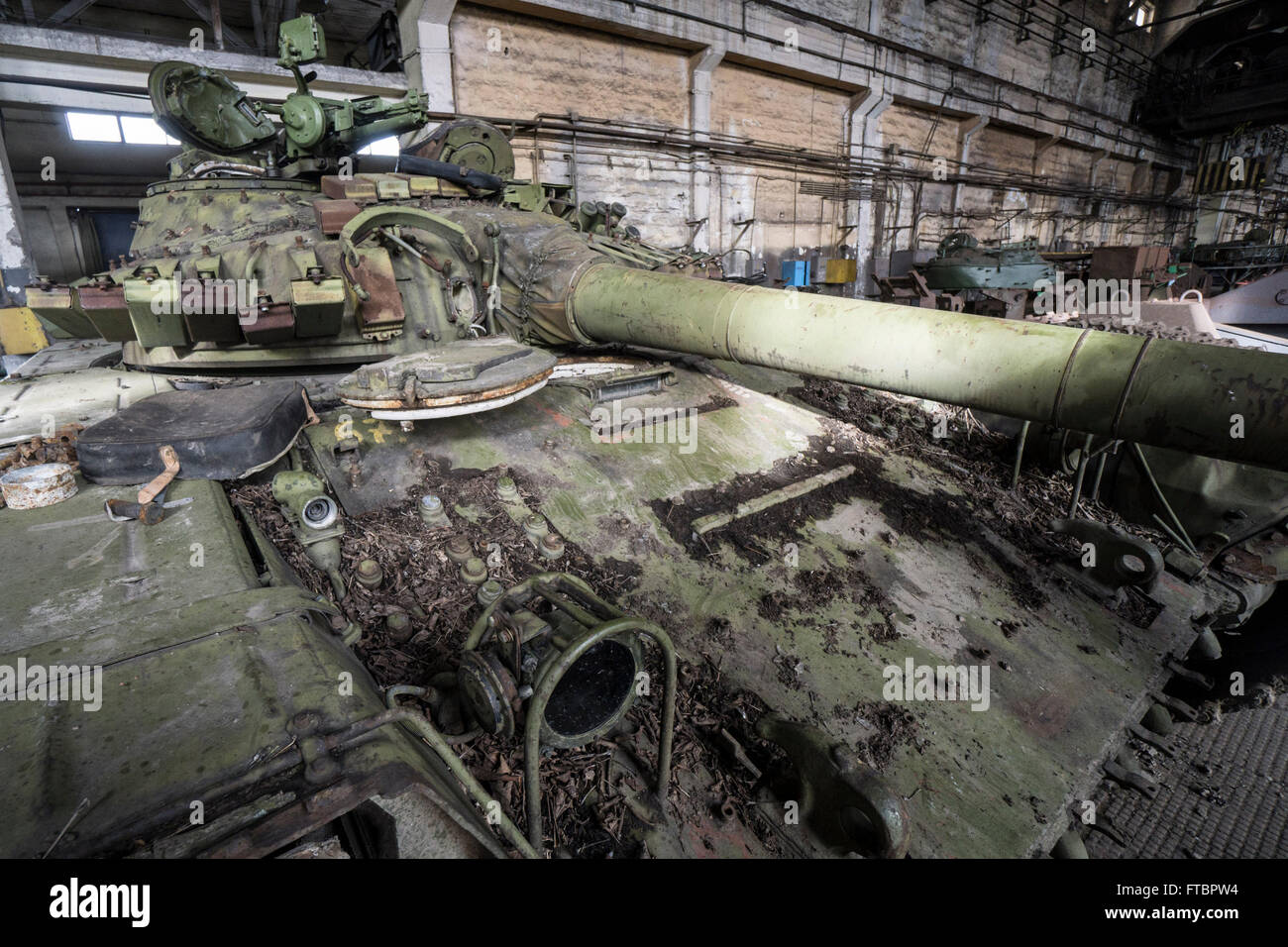 A tank waits to be fixed in a repair workshop at the Lviv Armor Plant ...