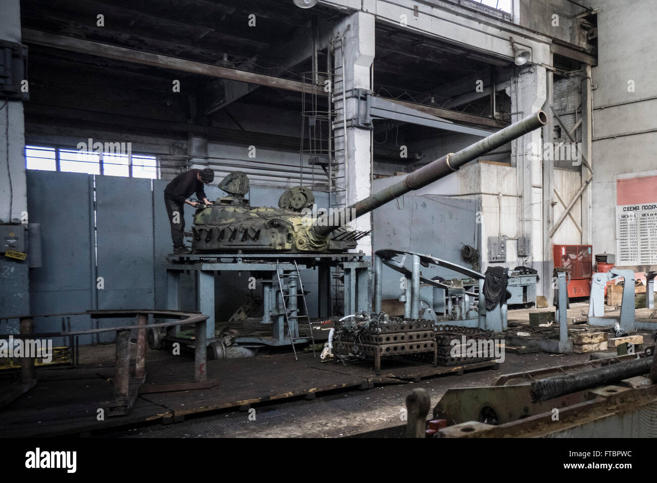 Workers repair tanks in a workshop at the Lviv Armor Plant Stock Photo ...