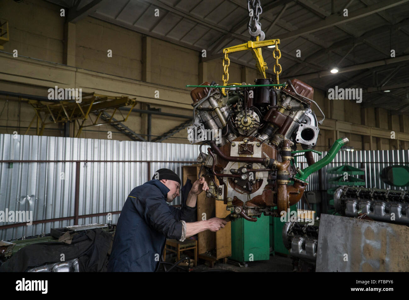 A tank engine gets cleaned in a repair workshop at the Lviv Armour ...