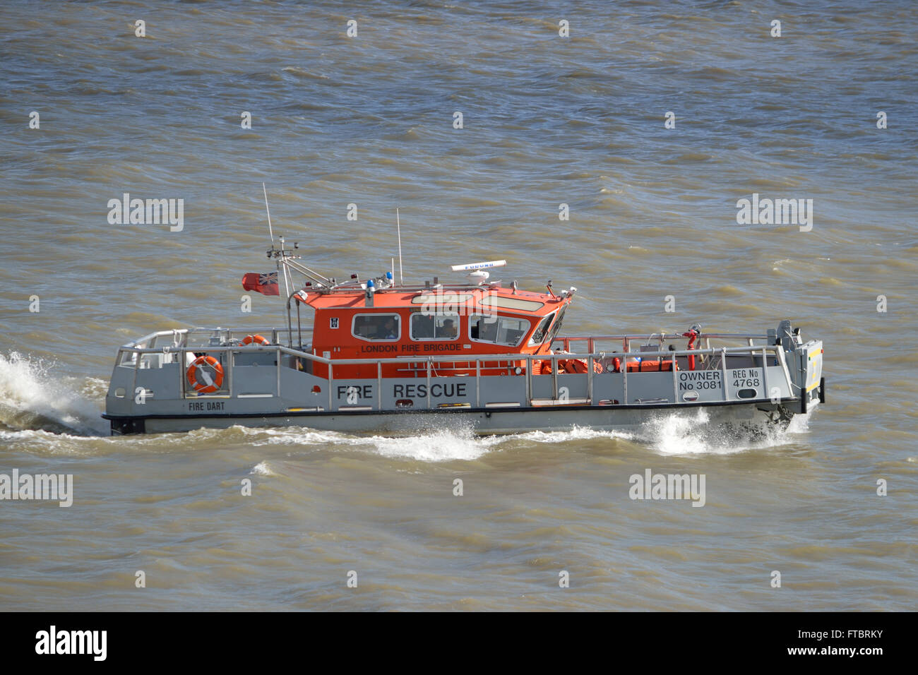 London Fire Brigade's fireboat Fire Dart makes it's way up the river ...