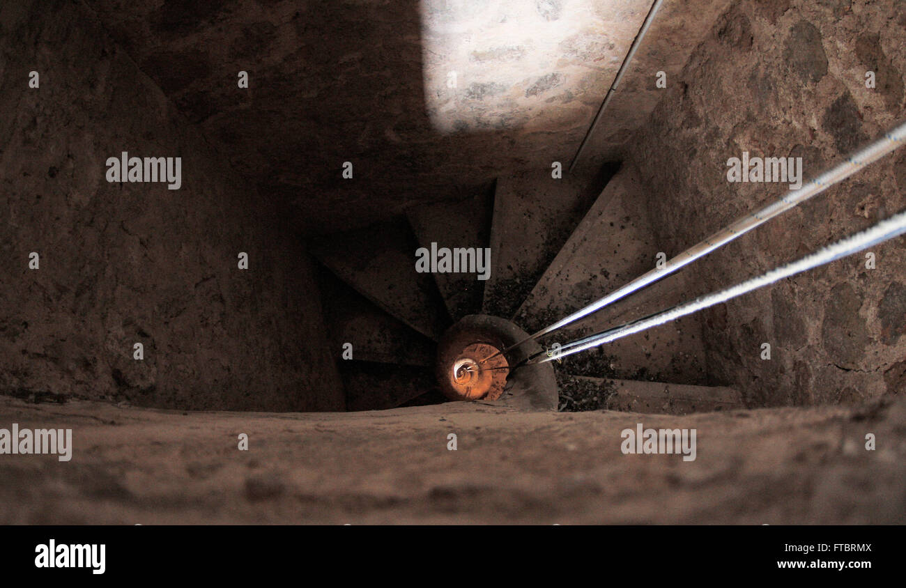 Bell Tower with spiral staircase. The rope goes up above the belfry ...