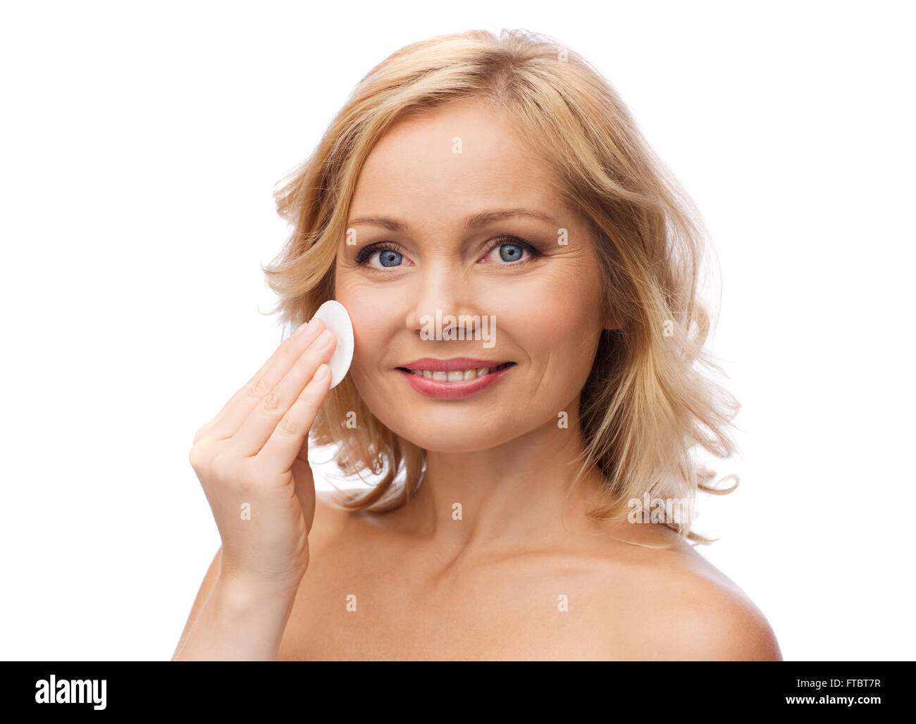 happy woman cleaning face with cotton pad Stock Photo - Alamy
