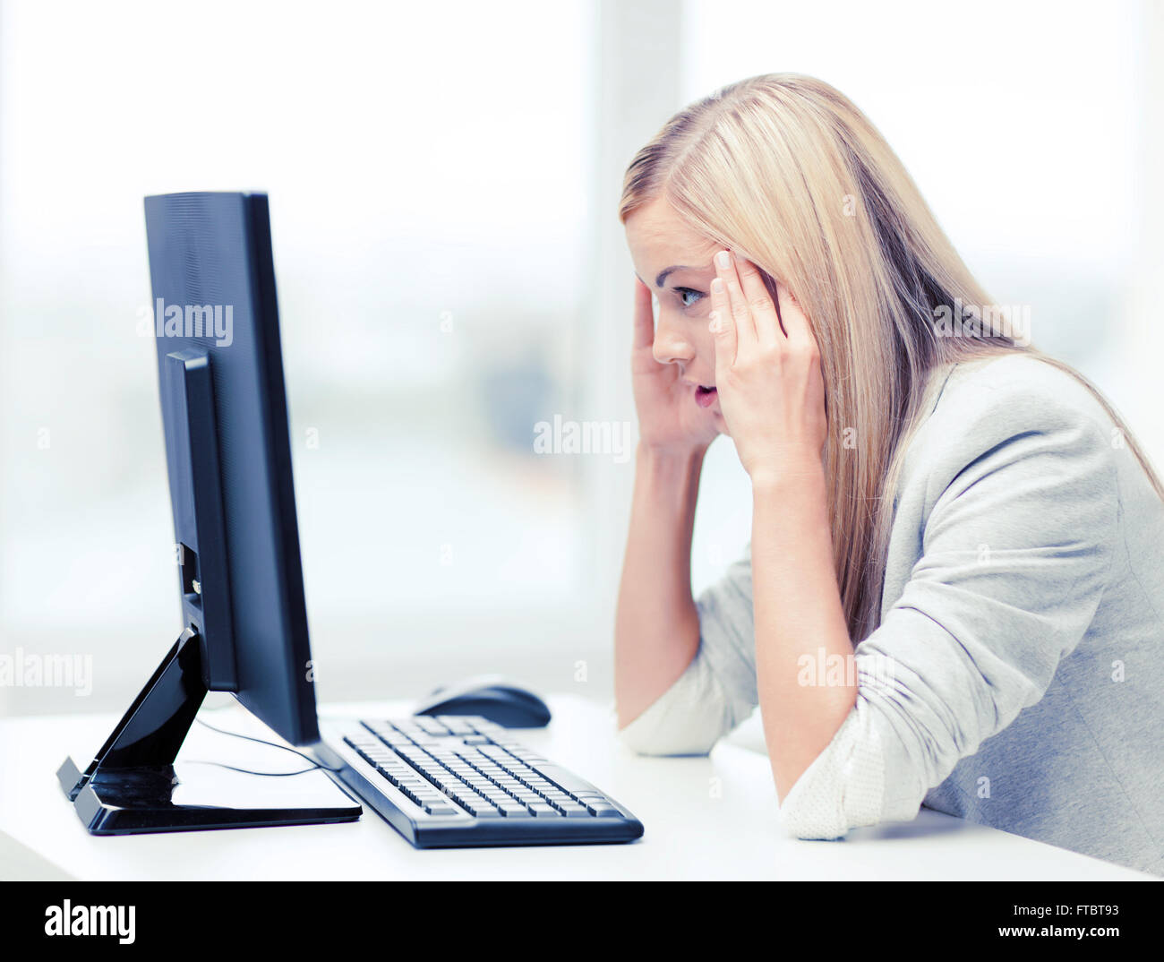 stressed woman with computer Stock Photo - Alamy