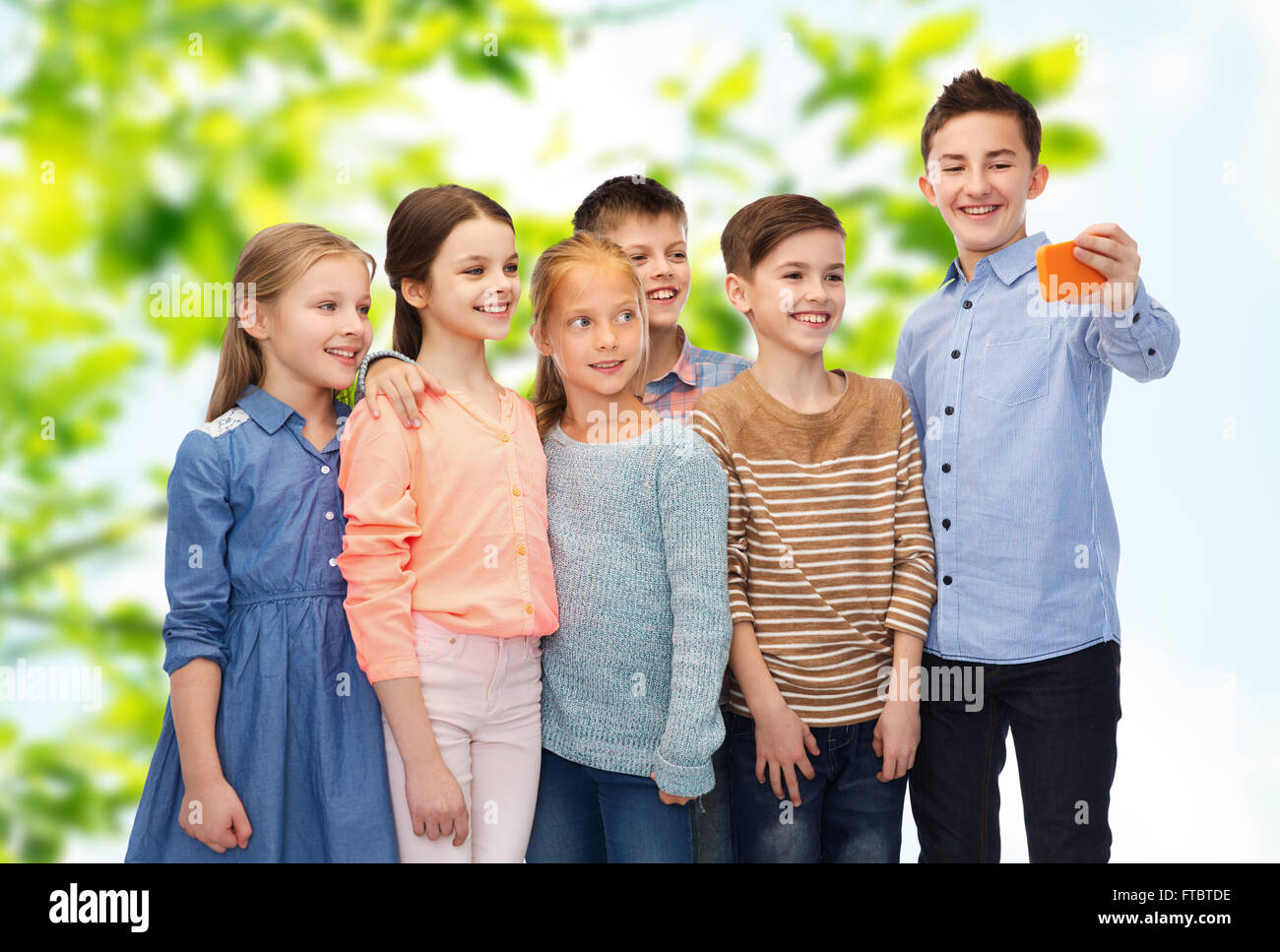 happy children talking selfie by smartphone Stock Photo - Alamy