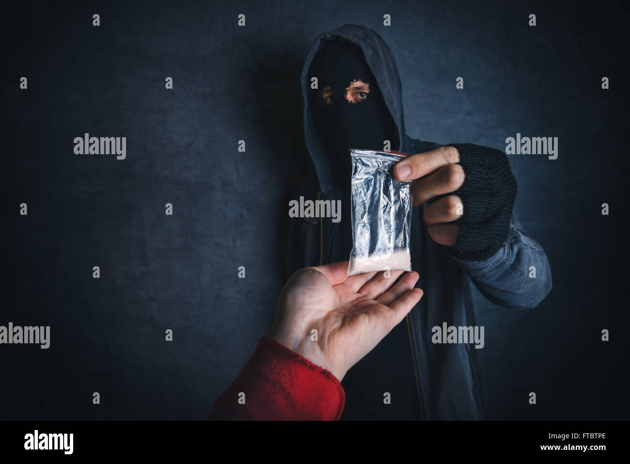 Drug dealer offering narcotic substance to addict on the street ...