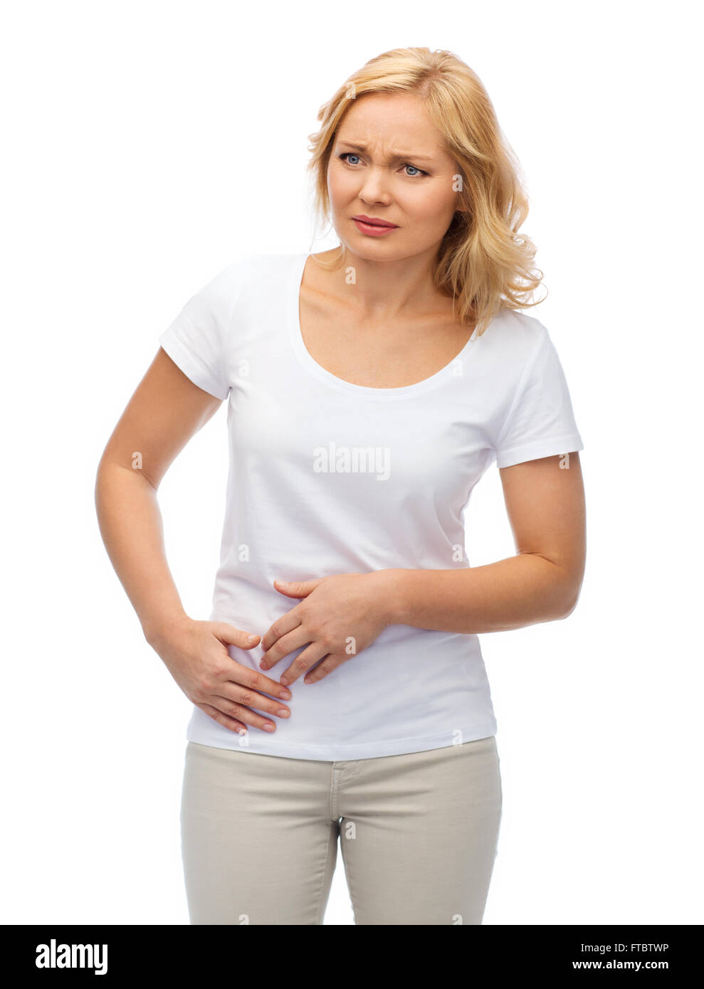 unhappy woman suffering from stomach ache Stock Photo - Alamy