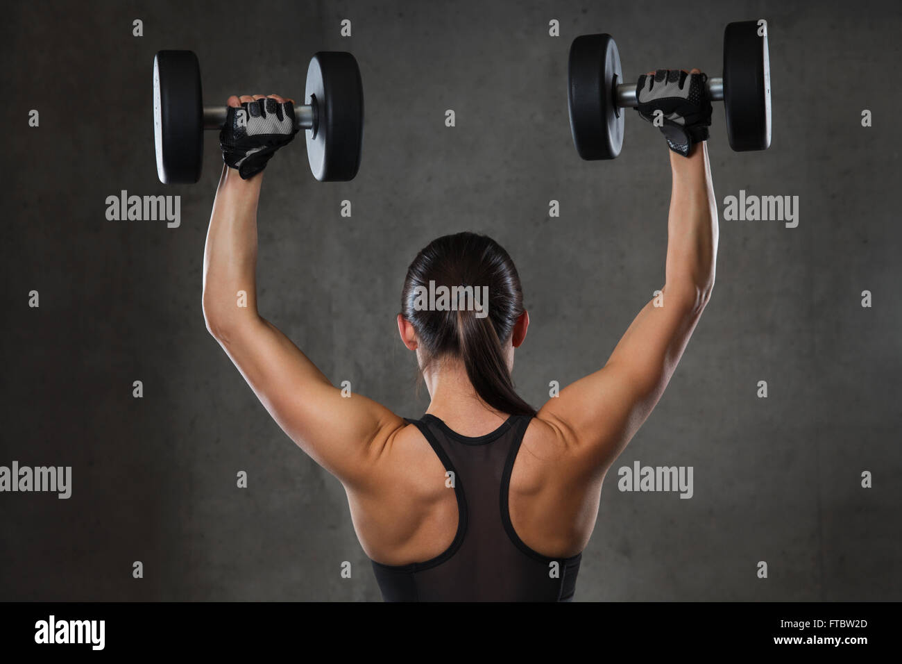 Back female muscle flexing hi-res stock photography and images - Alamy