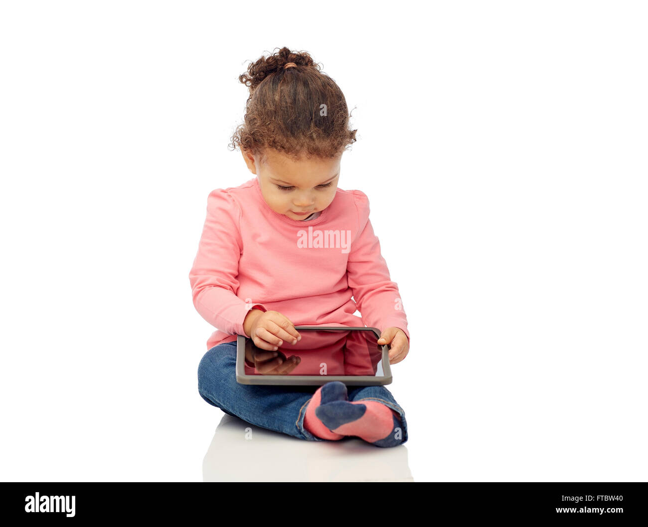 little baby girl playing with tablet pc computer Stock Photo - Alamy