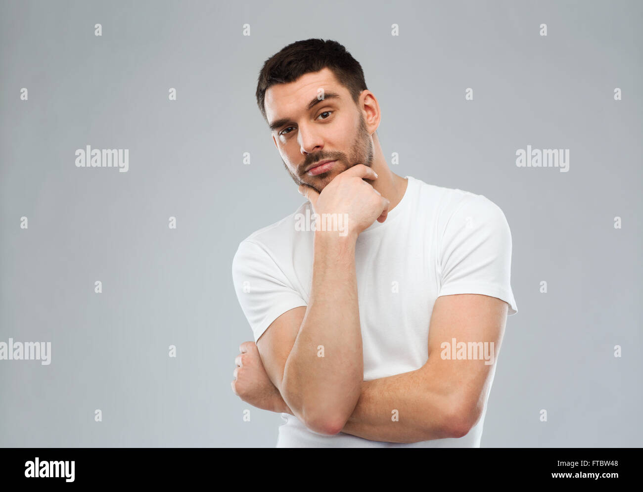 man thinking over gray background Stock Photo - Alamy