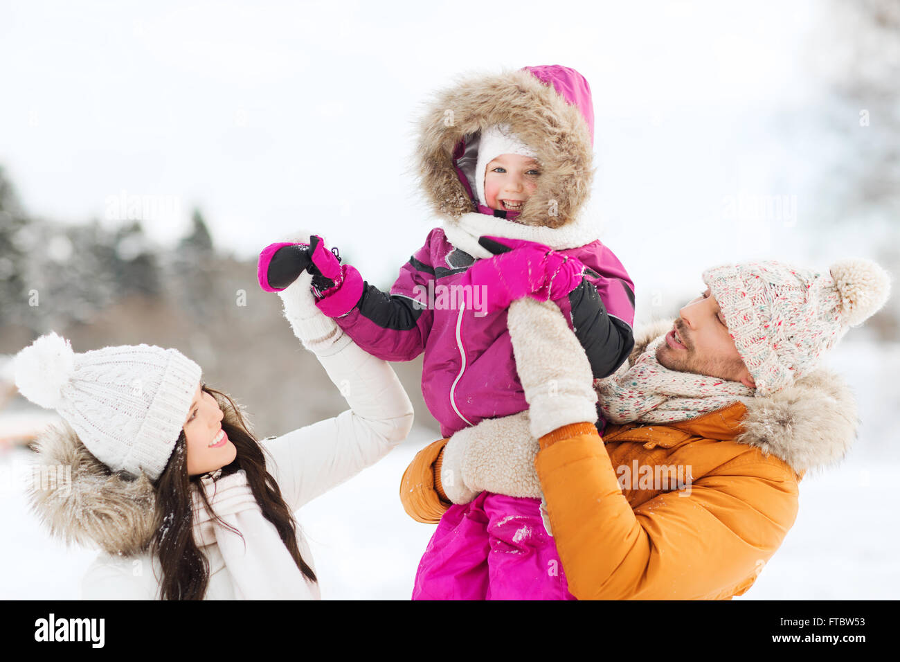 happy family with child in winter clothes outdoors Stock Photo - Alamy