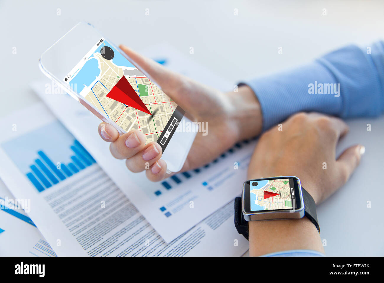 hands with navigator map on smart phone and watch Stock Photo - Alamy