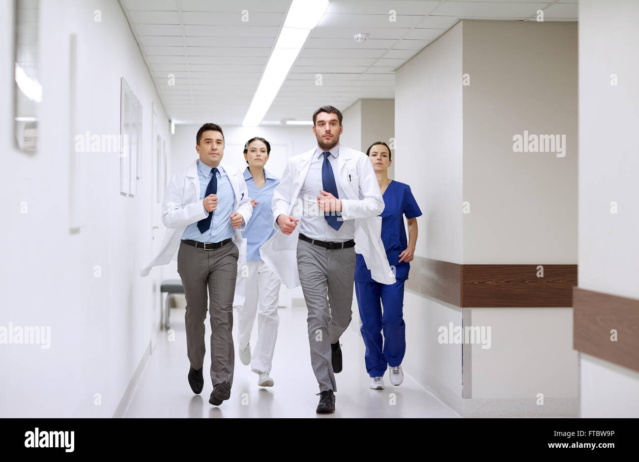 group of medics walking along hospital Stock Photo - Alamy