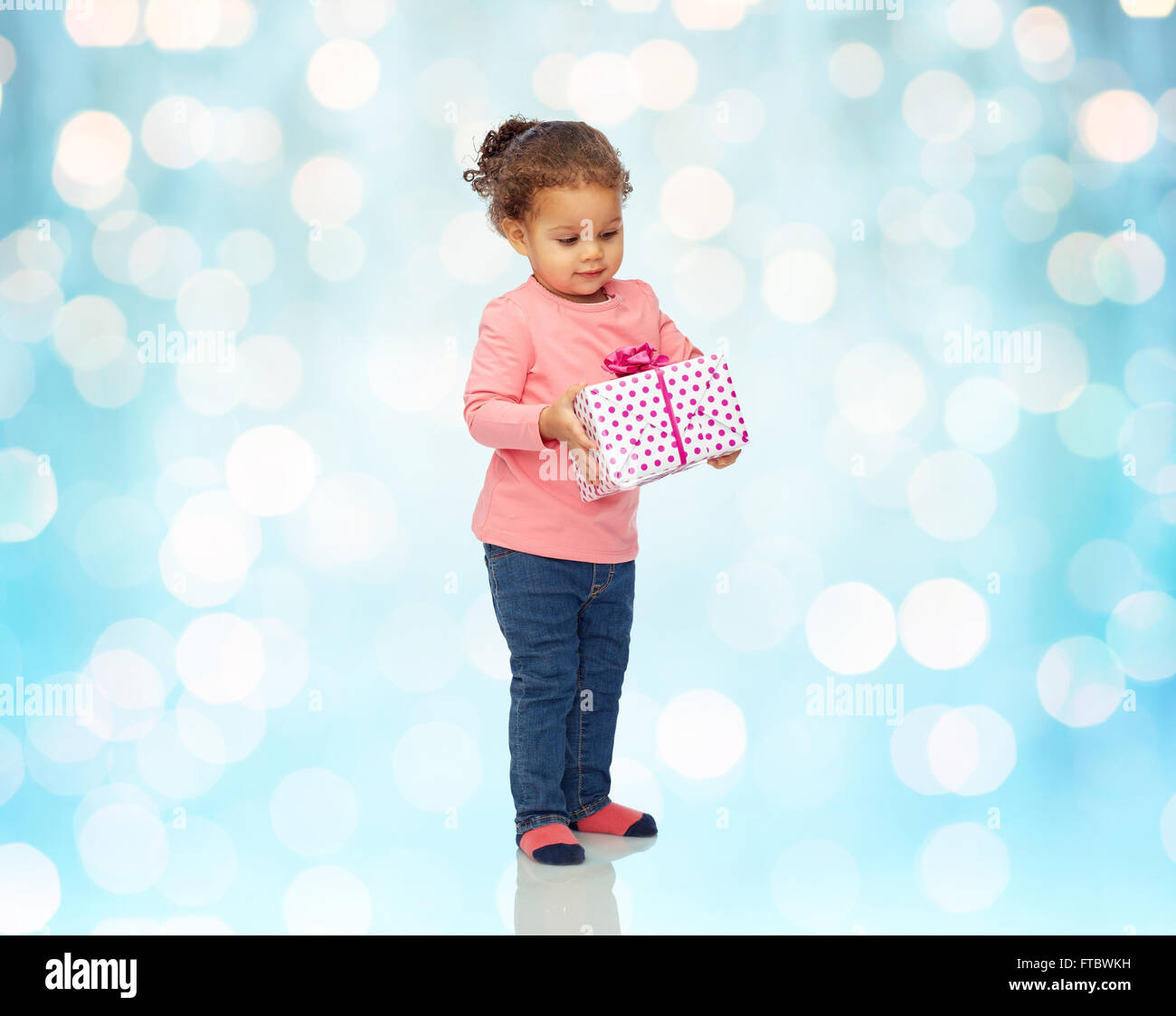 beautiful little baby girl with birthday present Stock Photo - Alamy
