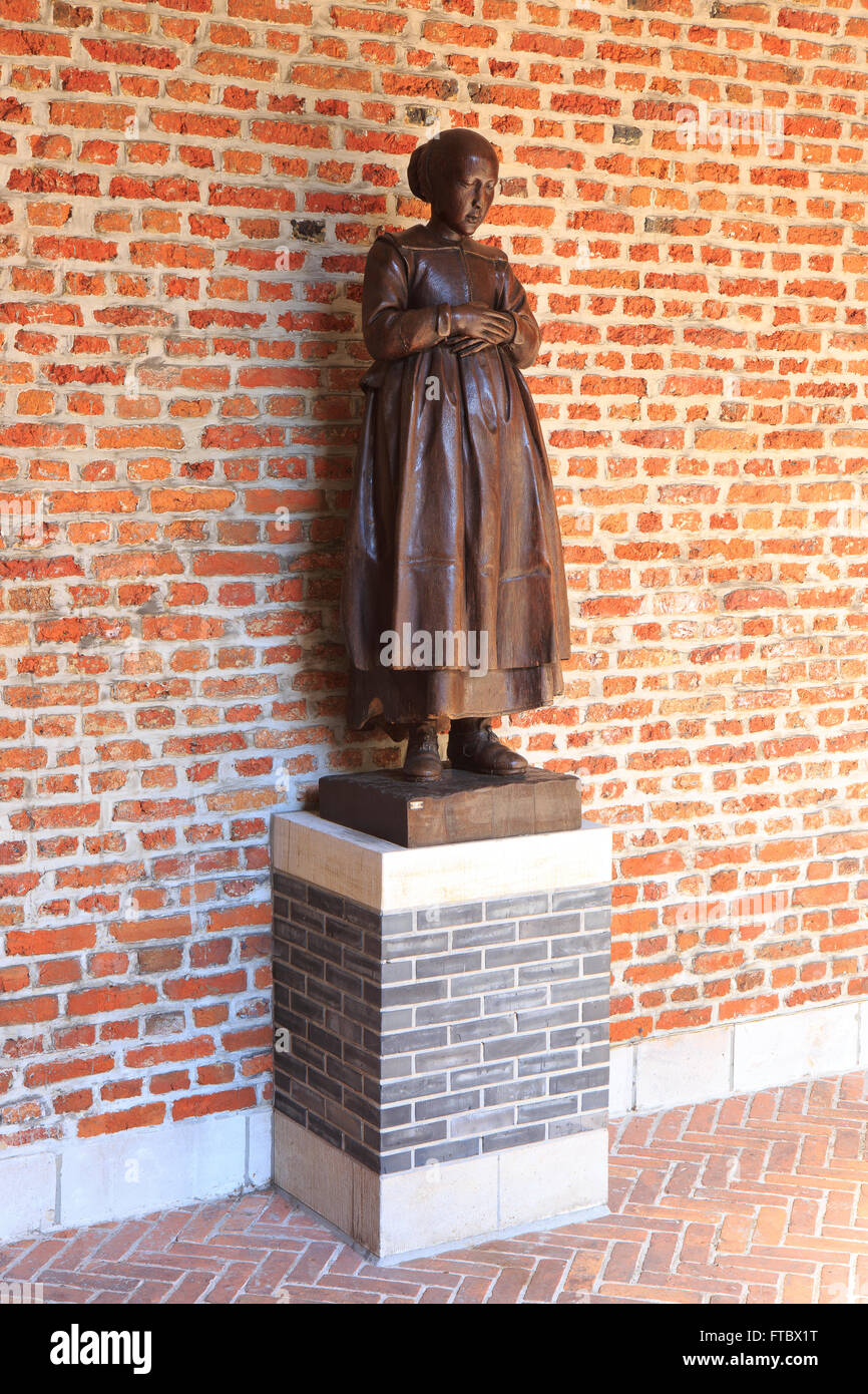 A wooden statue of an orphaned girl at the Maidens' House Museum ...