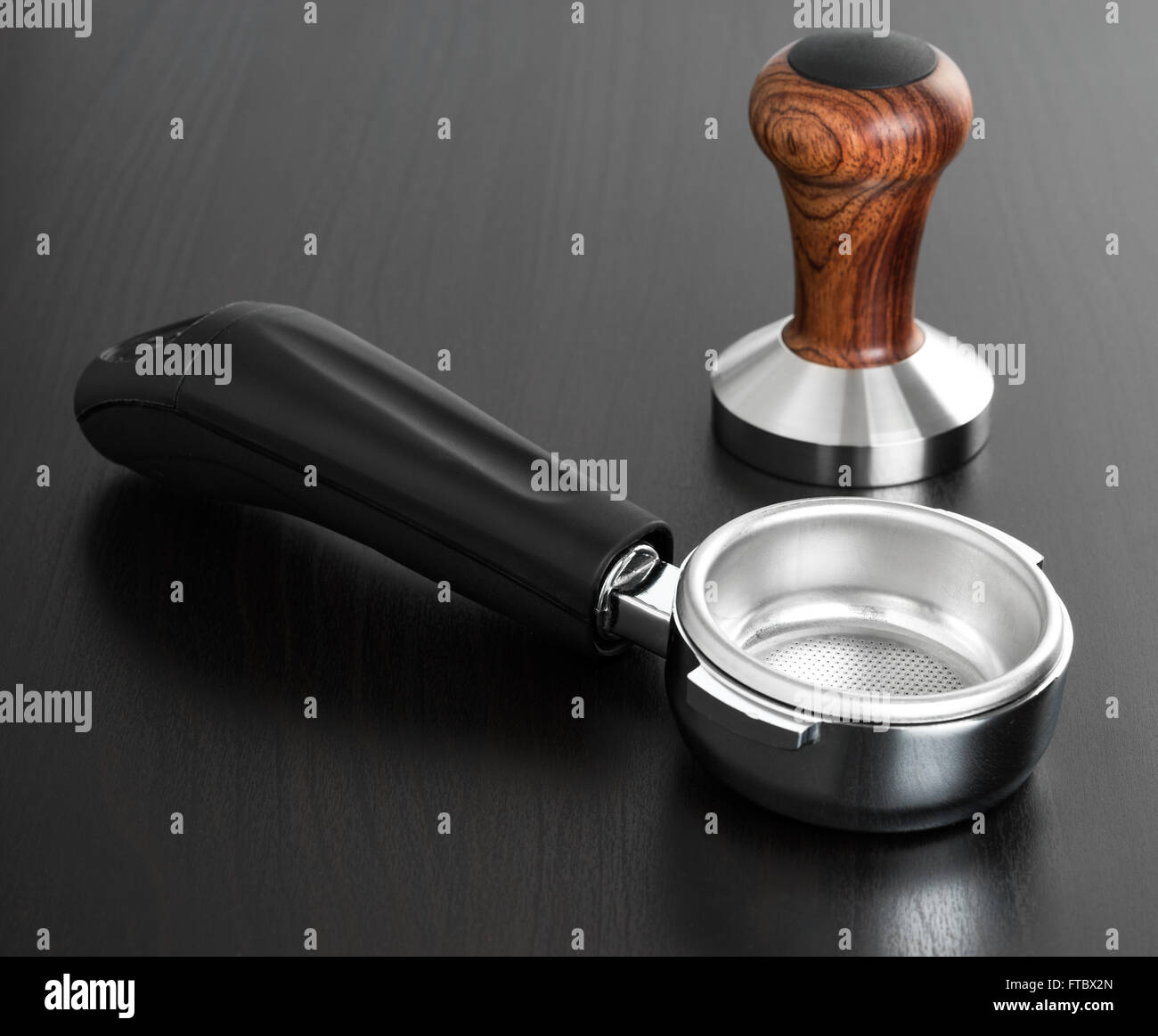 Wooden temper and coffee, close-up Stock Photo - Alamy